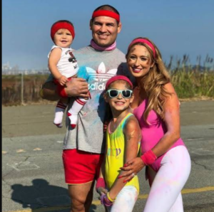 Cain and his two child and wife image. | Celebrities InfoSeeMedia